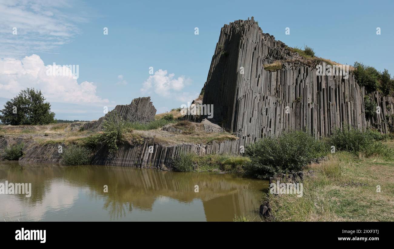 Basalt columns of volcanic origin with a regular geometric cross ...