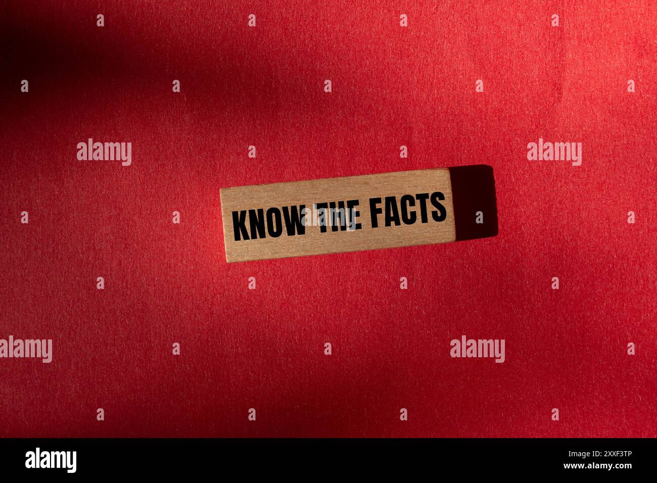 Know the facts message written on wooden block with red background ...
