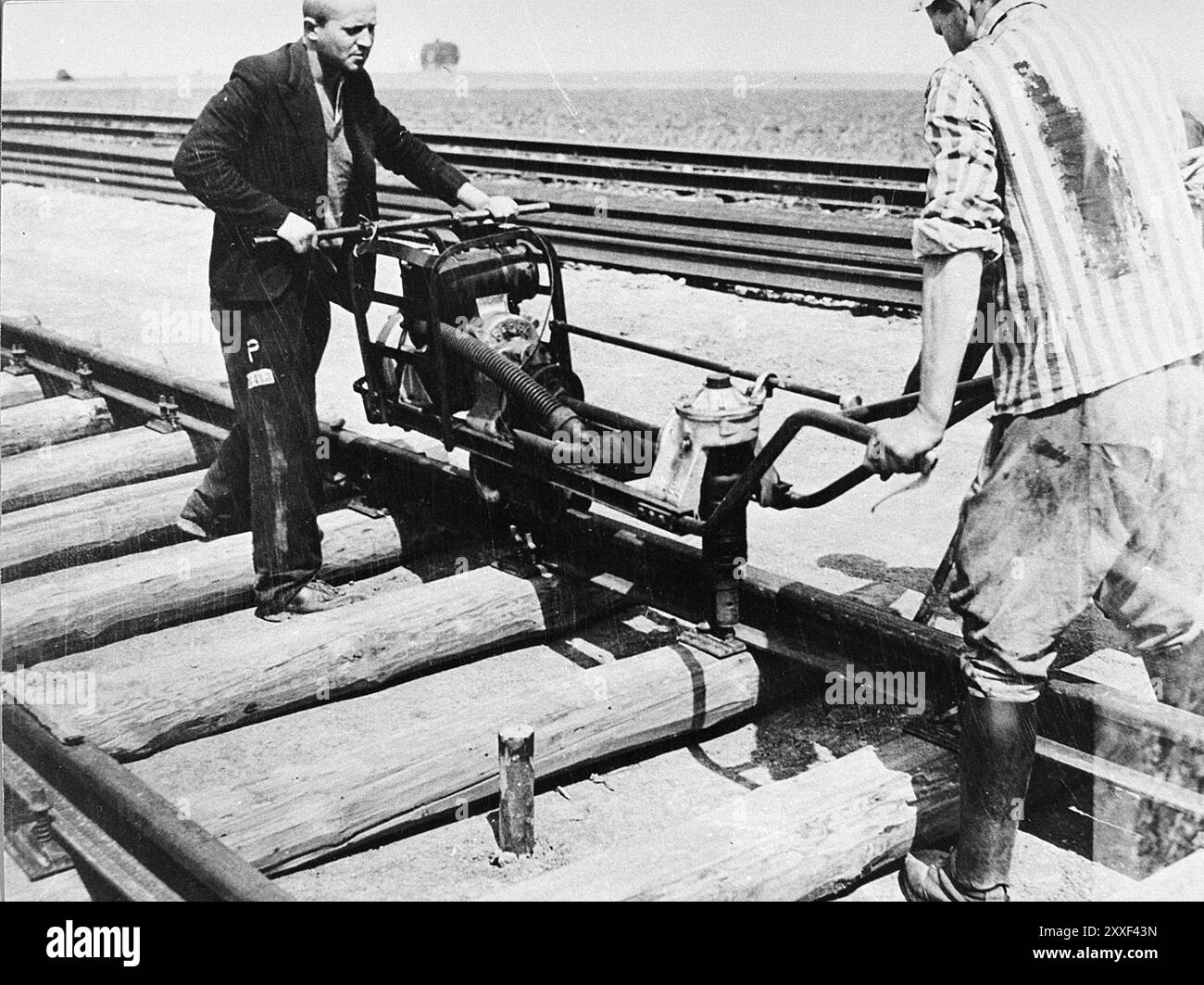 Forced labour prisoners from the Buchenwald concentration camp building ...