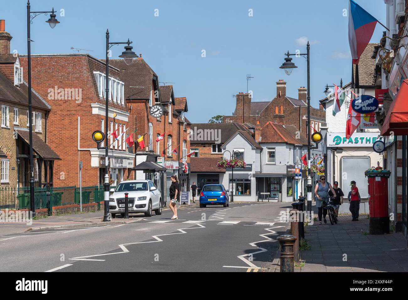 View of Bagshot High Street with shops and businesses, Surrey, England ...