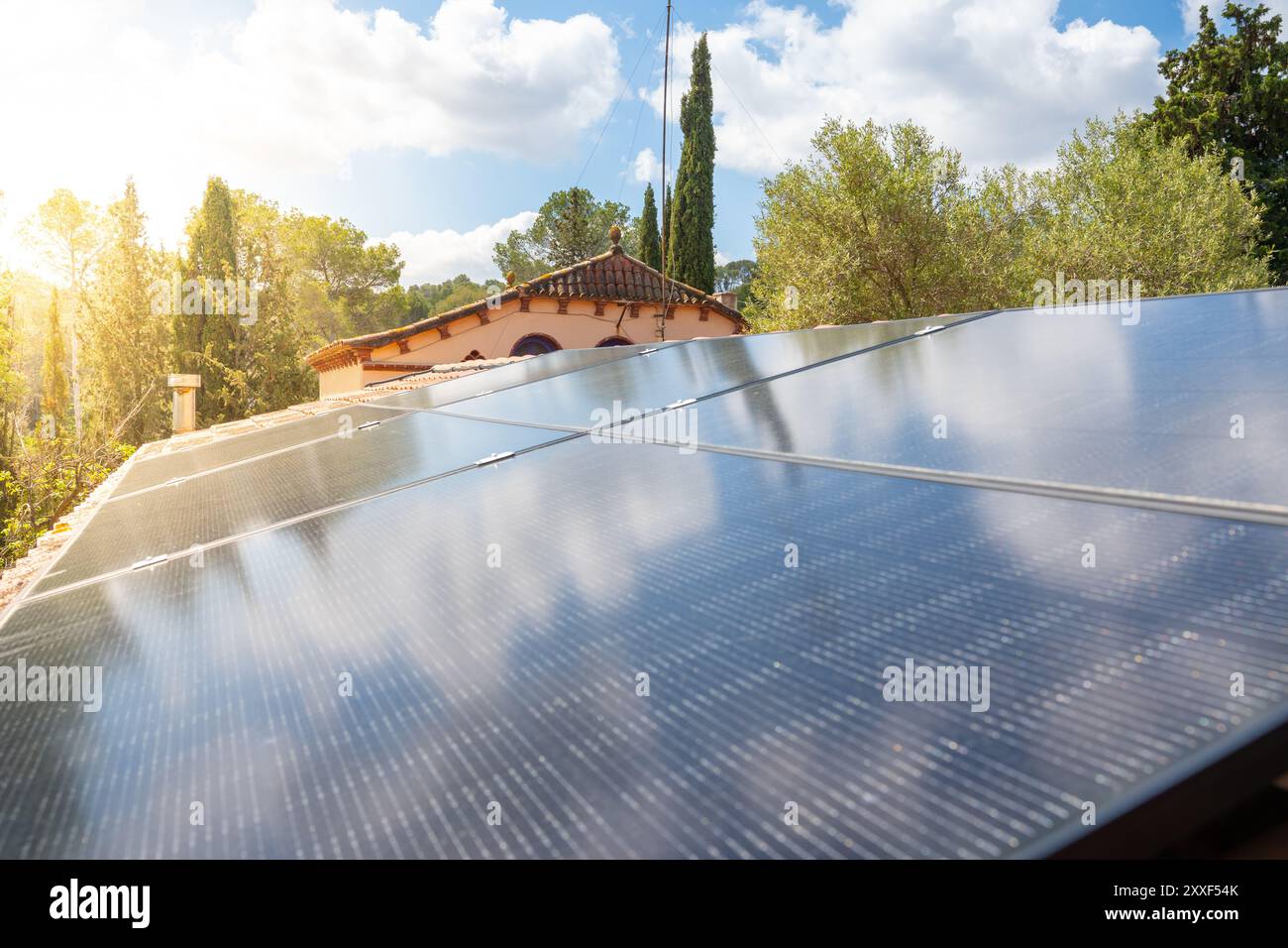 Solar panels line the rooftop, harnessing energy from the sun Stock ...