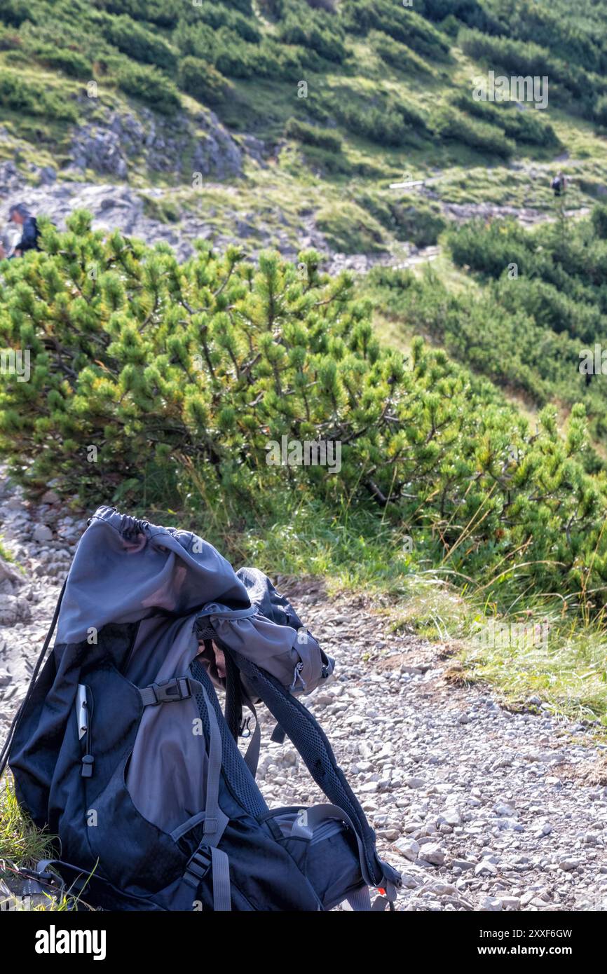 hiking in the mountains with a backpack placed on the ground Stock ...