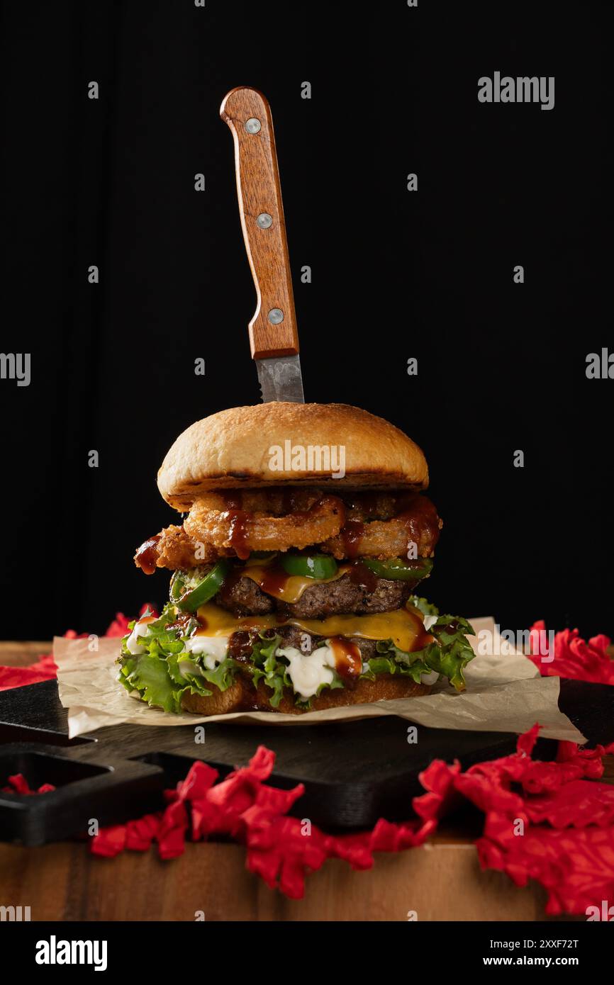 Rodeo Burger on a black background Stock Photo - Alamy