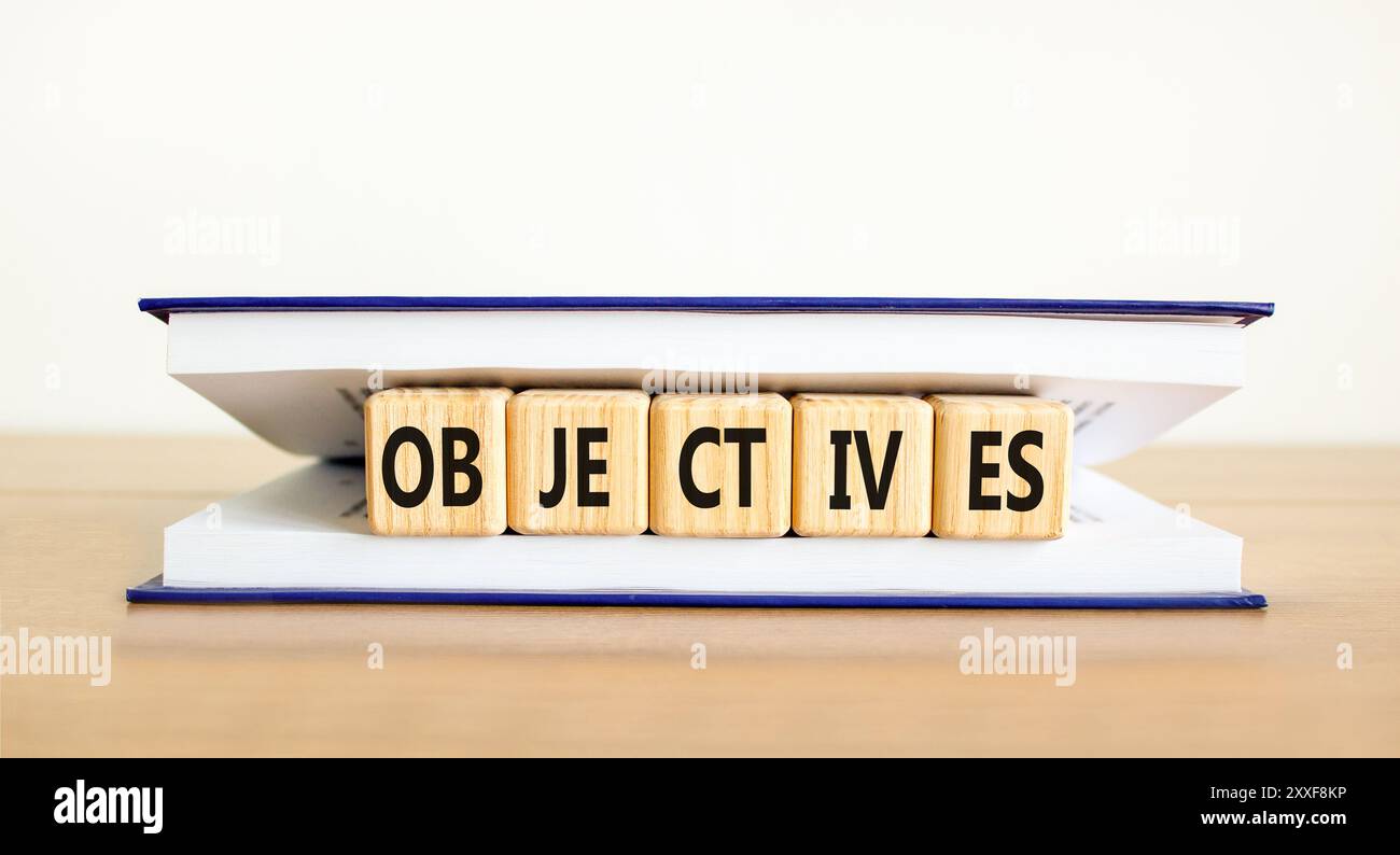 Objectives symbol. Concept word Objectives on beautiful wooden cubes in ...