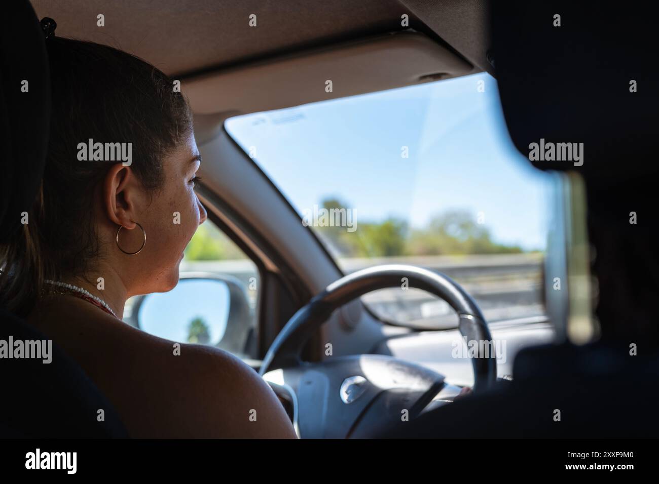 Driving a car from the back seat hi-res stock photography and images ...