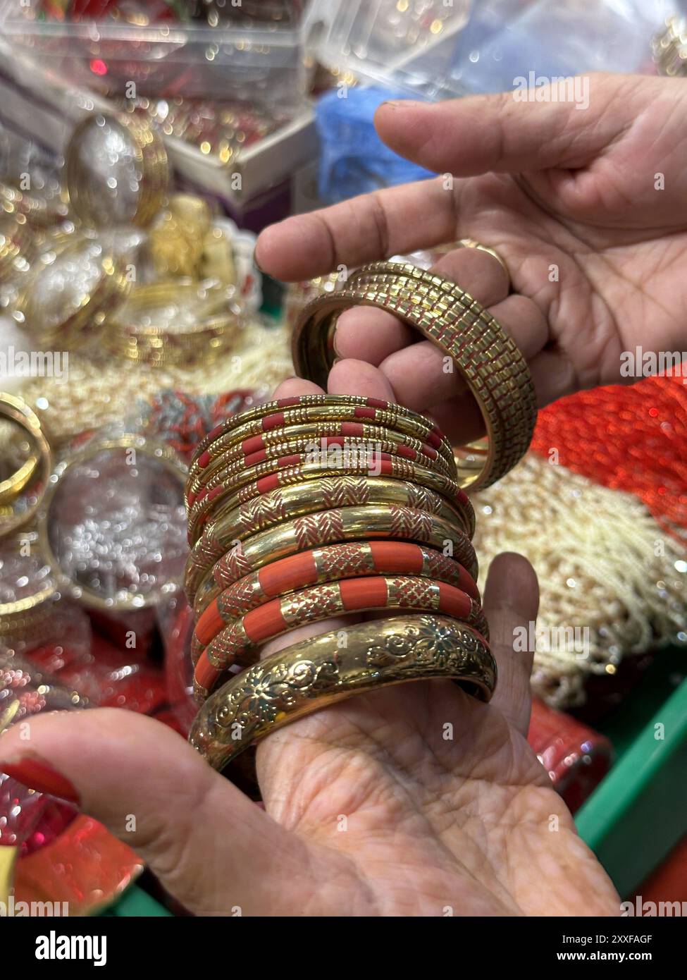 August 24, 2024: A Nepali woman selects bangles at a stall of the Teej ...