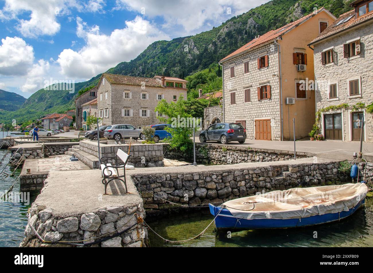 View of Muo village promenade with traditional stone houses and fishing ...
