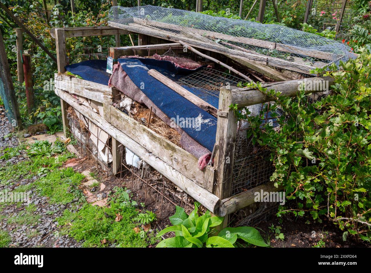 Wooden composting frames in a garden, UK. 2024 Stock Photo - Alamy