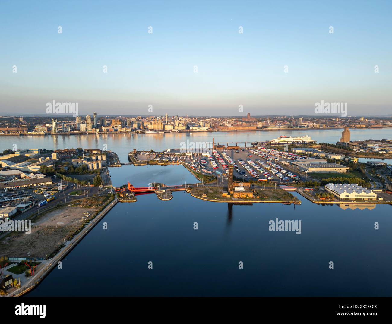 Aerial view of Birkenhead Docks East Float with Liverpool in background ...