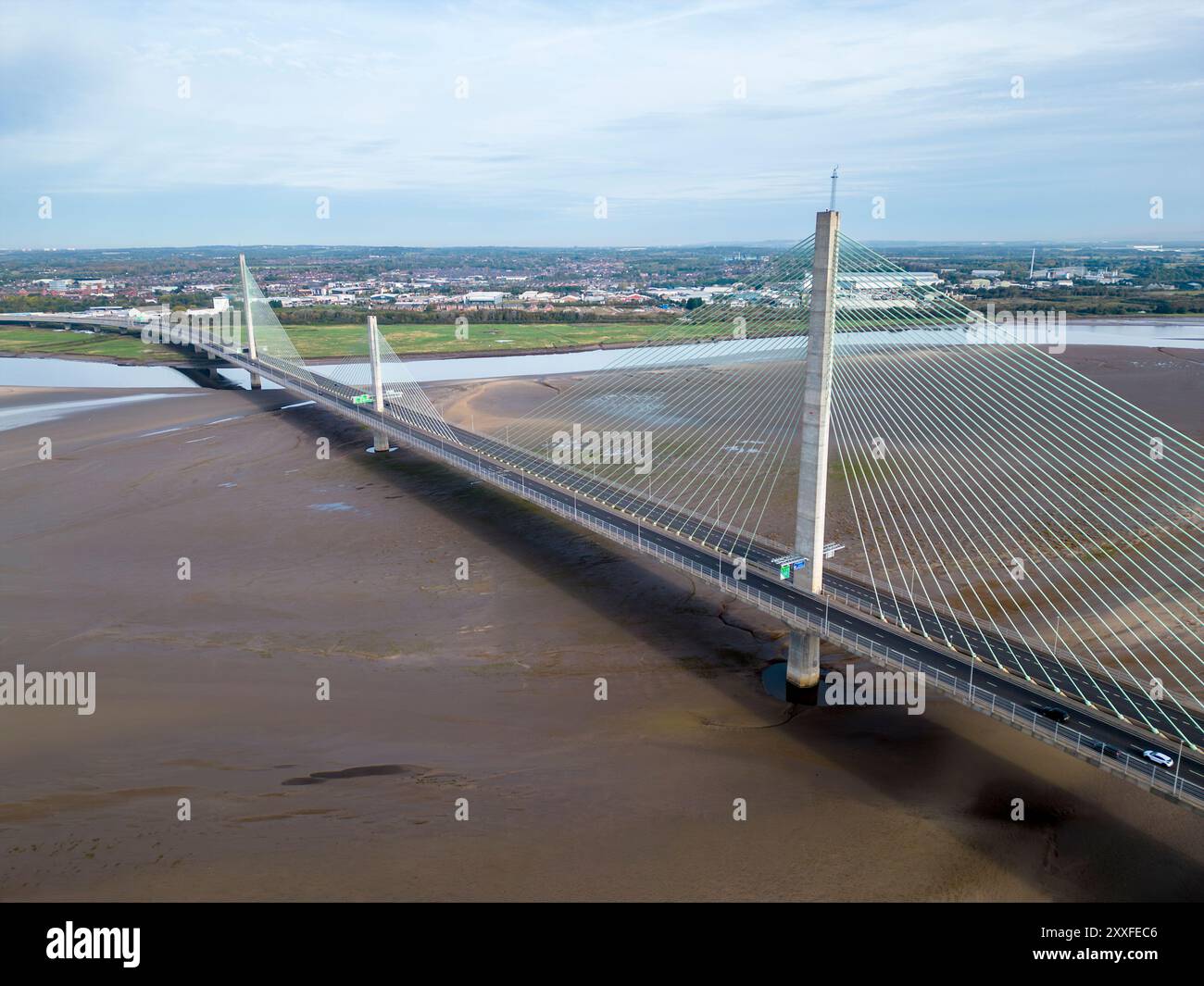 Aerial view of The Mersey Gateway Bridge over the Mersey estuary ...