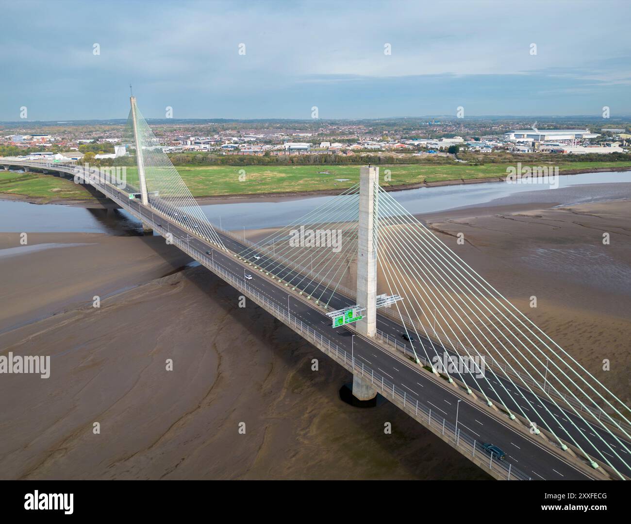 Aerial establishing view of The Mersey Gateway Bridge over the Mersey ...