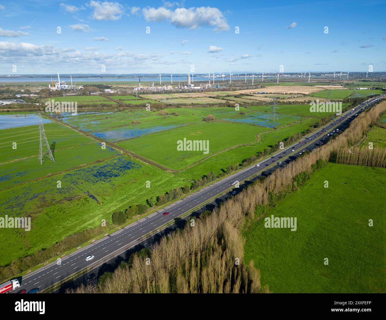 M56 Motorway and Frodsham wind Farm, Helsby village, Cheshire, England ...