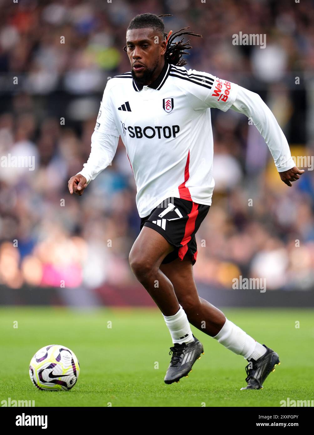 Fulham's Alex Iwobi in action during the Premier League match at Craven ...