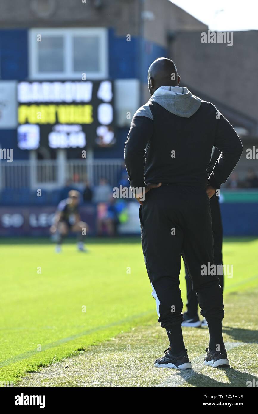 Barrow, UK, 24th August 2024. Port Vale Manager Darren Moore looks on ...