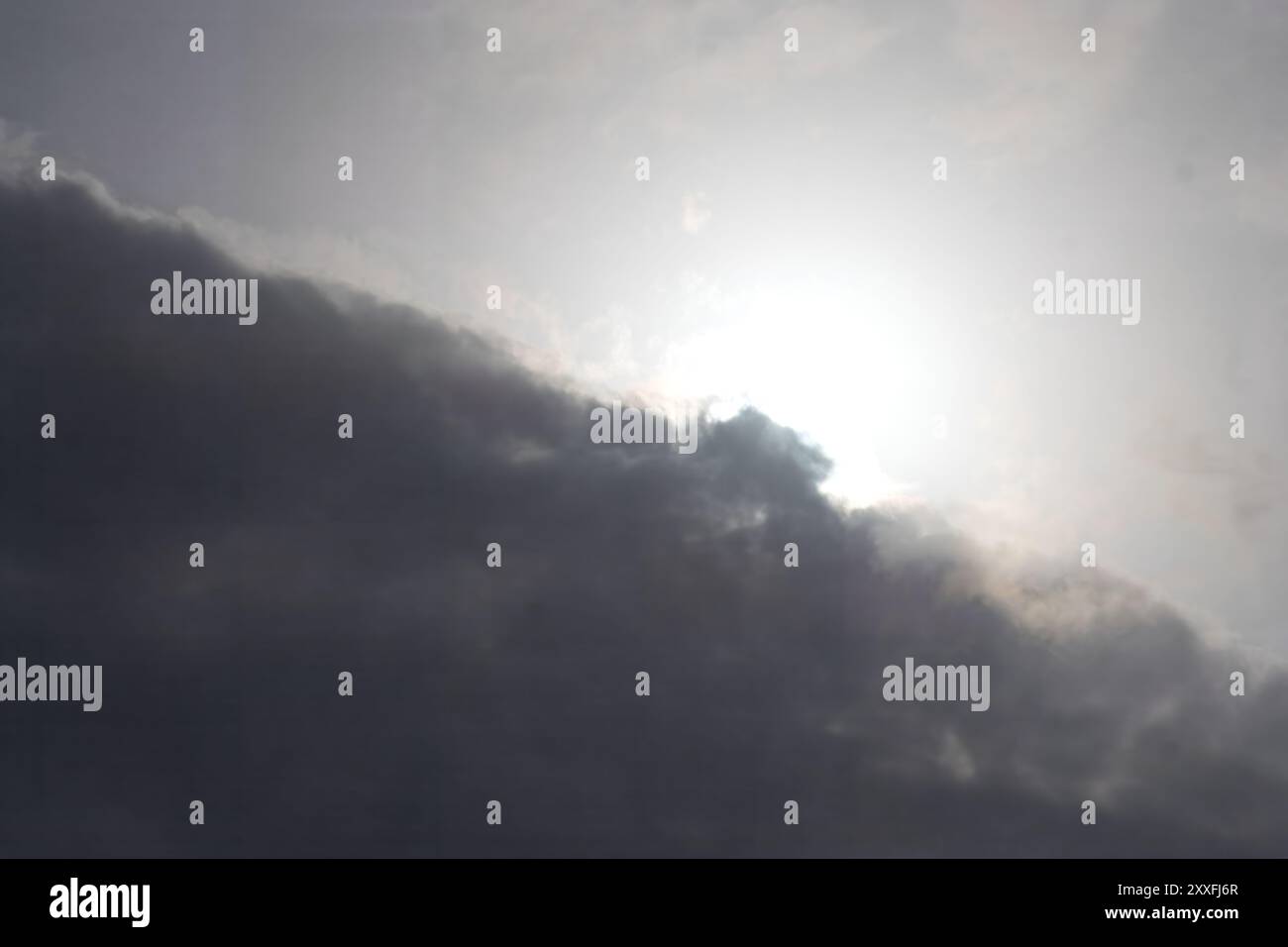 Sunburst Through Moody Cloudscape - A Symbol of Hope Stock Photo - Alamy