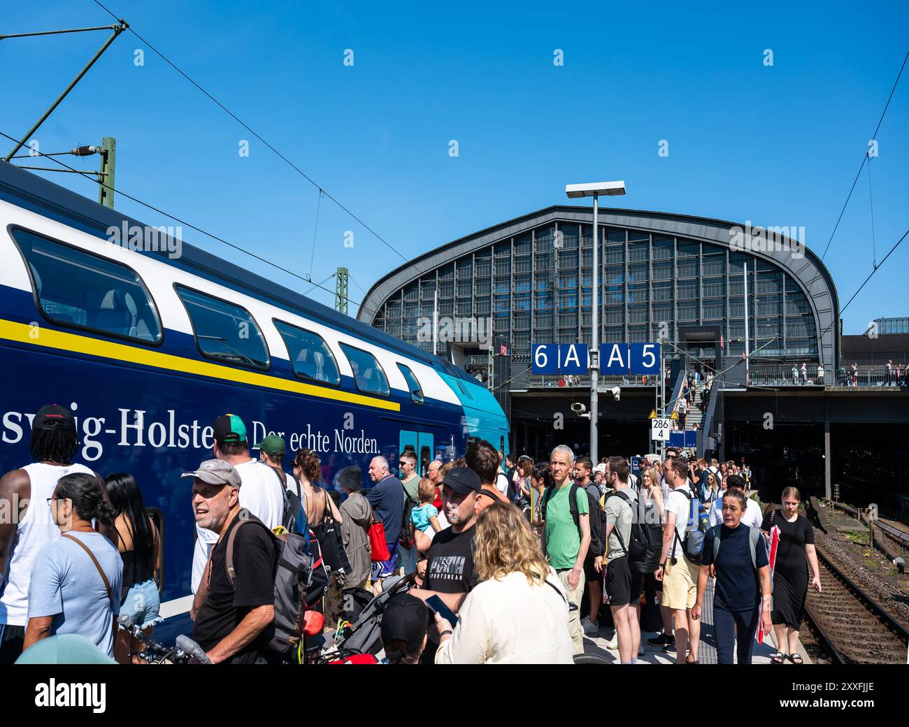 Hamburg, Germany, July 20, 2024 - Crowded platform embarking for the ...