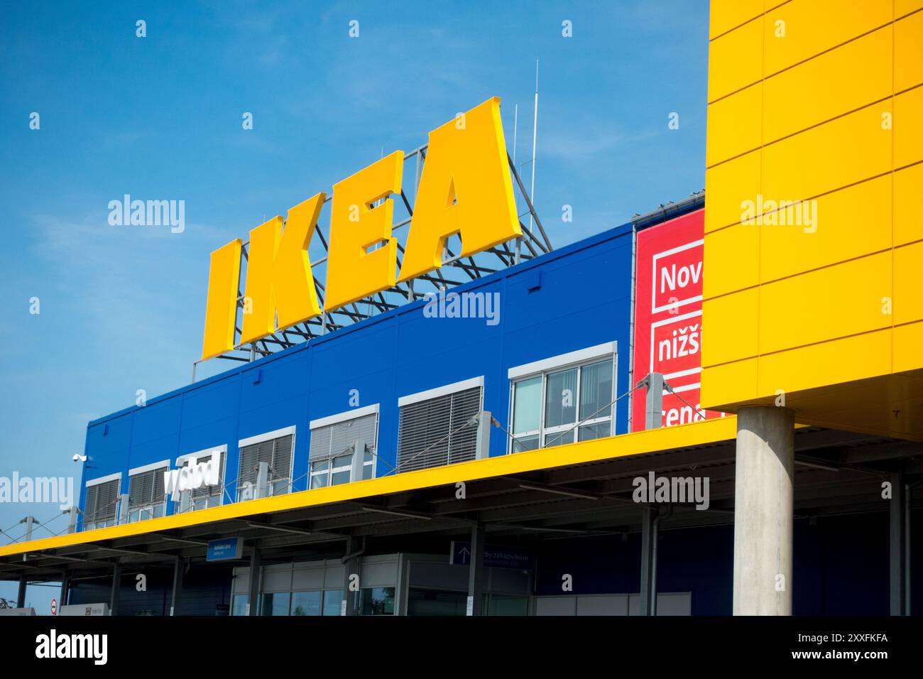 Sign Ikea logo against blue sky Stock Photo - Alamy
