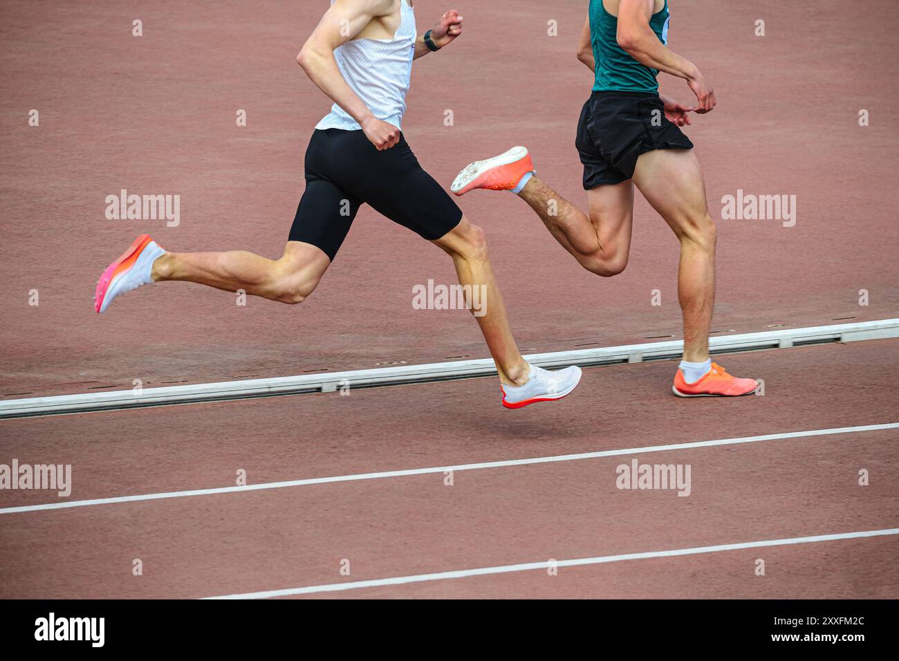 two athletes running 800 meters at stadium, athletics competition Stock ...