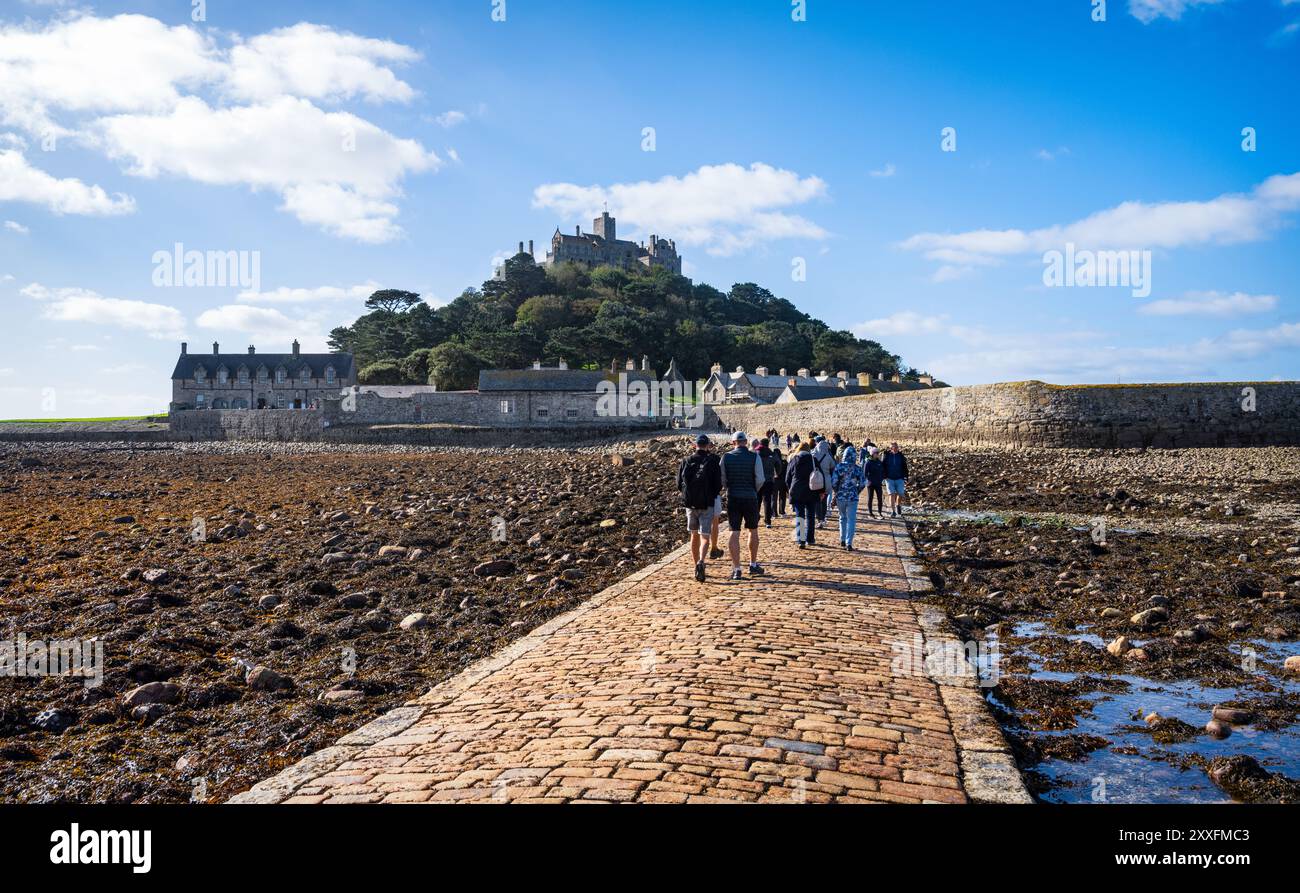 Tourists walking on the causeway to St Michael's Mount at low tide. The ...