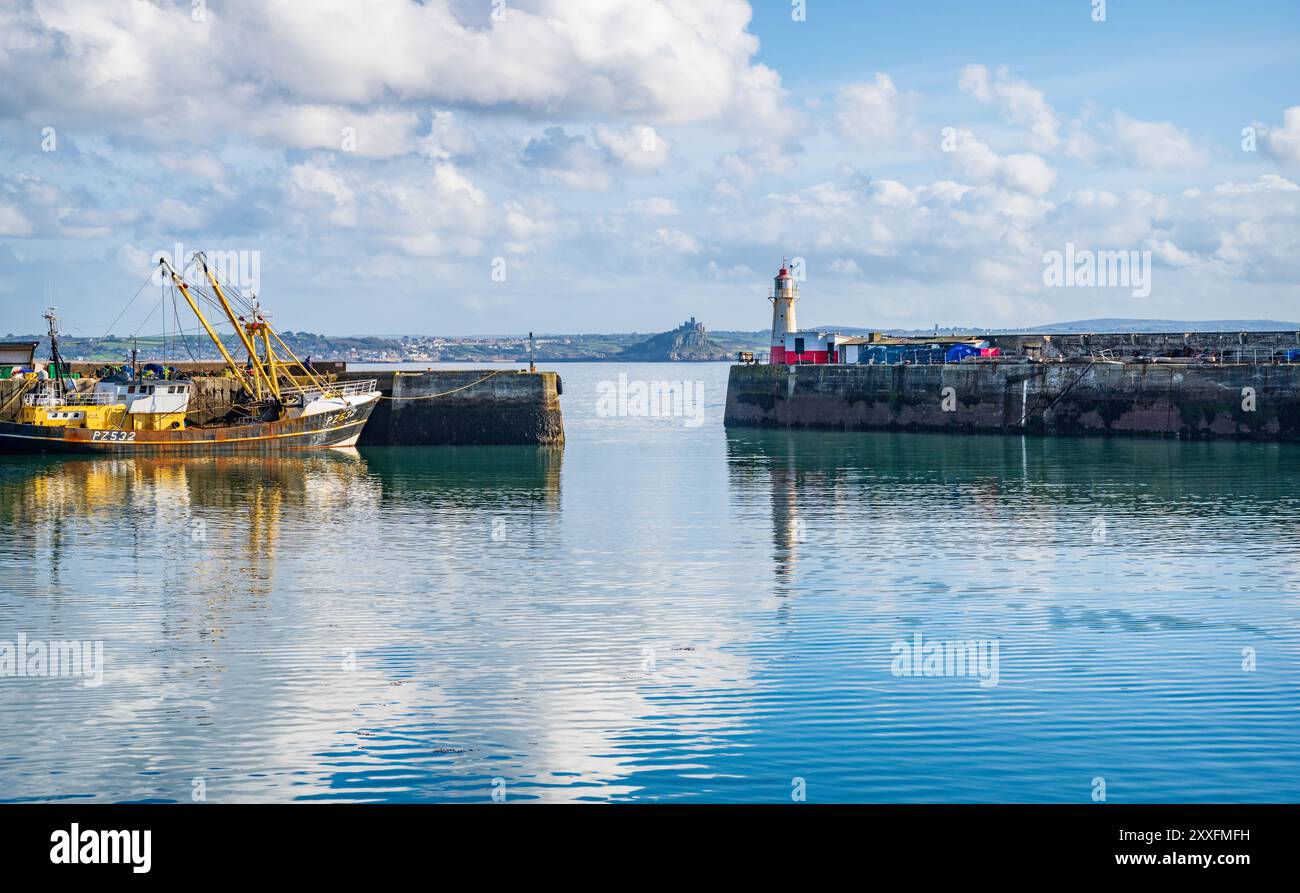 The harbour entrance at Newlyn, Cornwall, UK, with St Michael's Mount ...