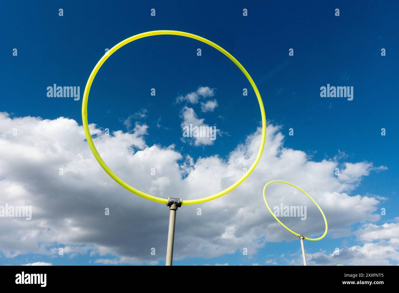 Lemon-colored circles against a blue sky with a white cloud Stock Photo ...