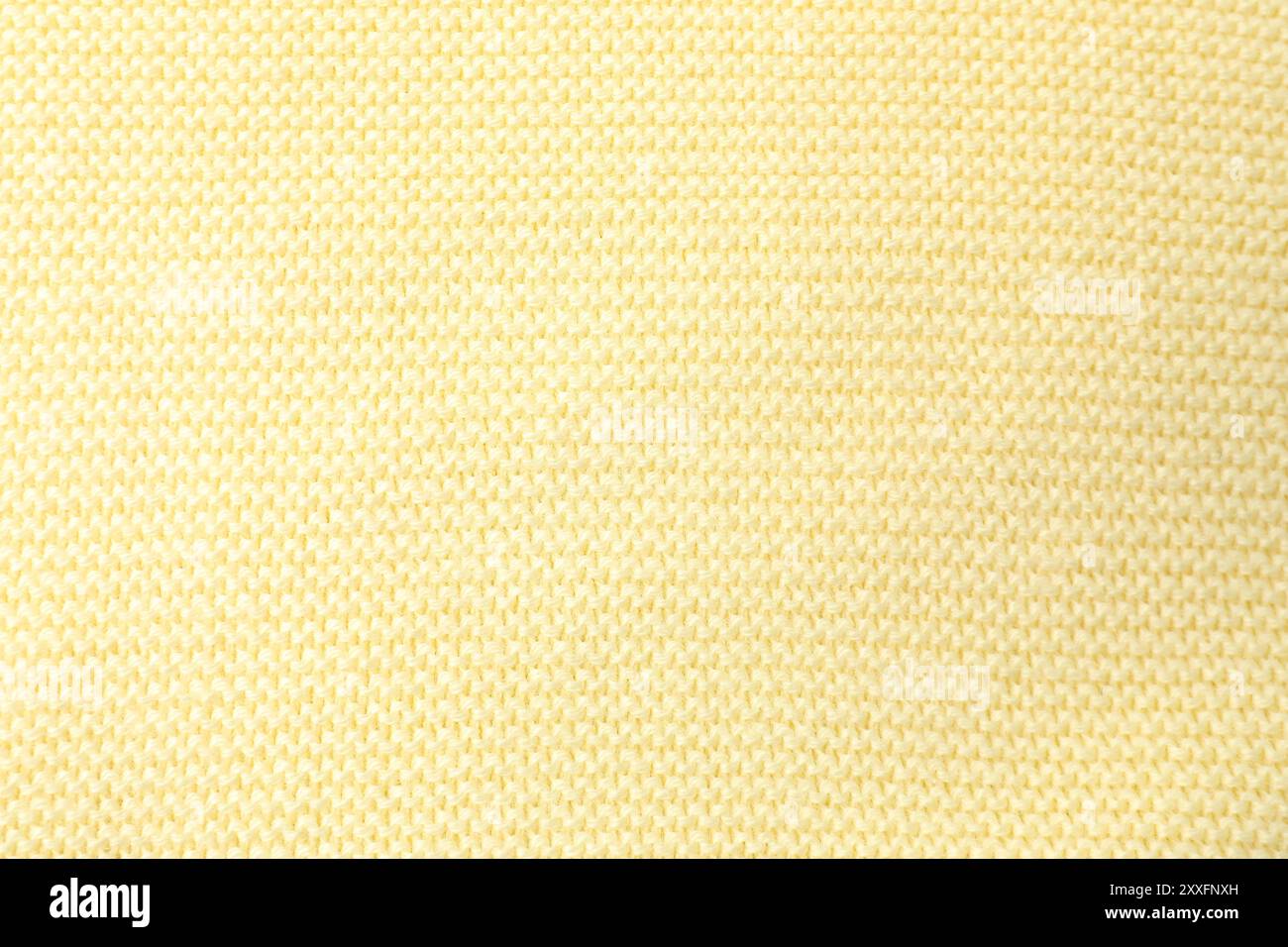 Texture of light yellow knitted fabric as background, top view Stock ...