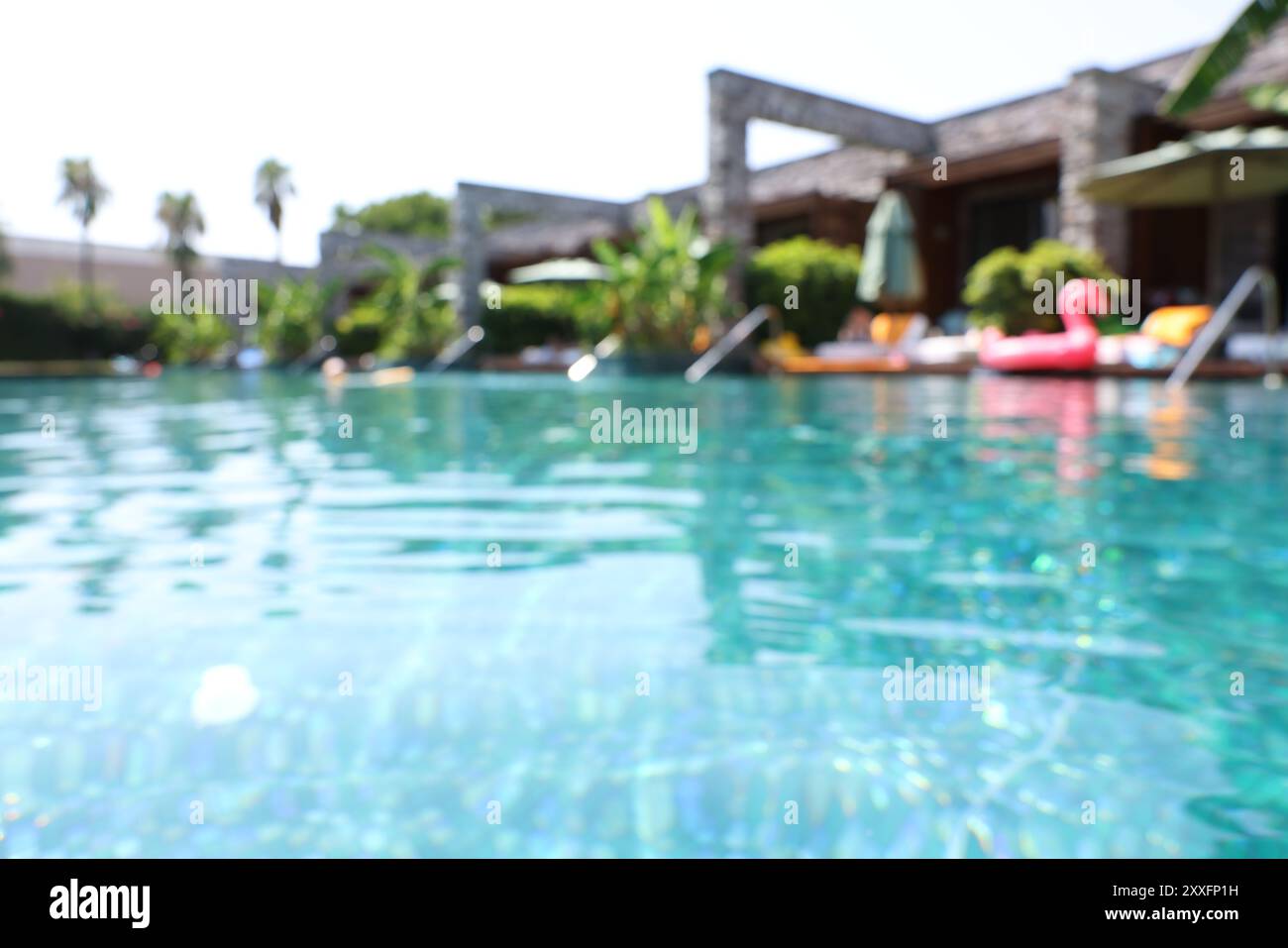 Blurred view of outdoor swimming pool at luxury resort Stock Photo - Alamy