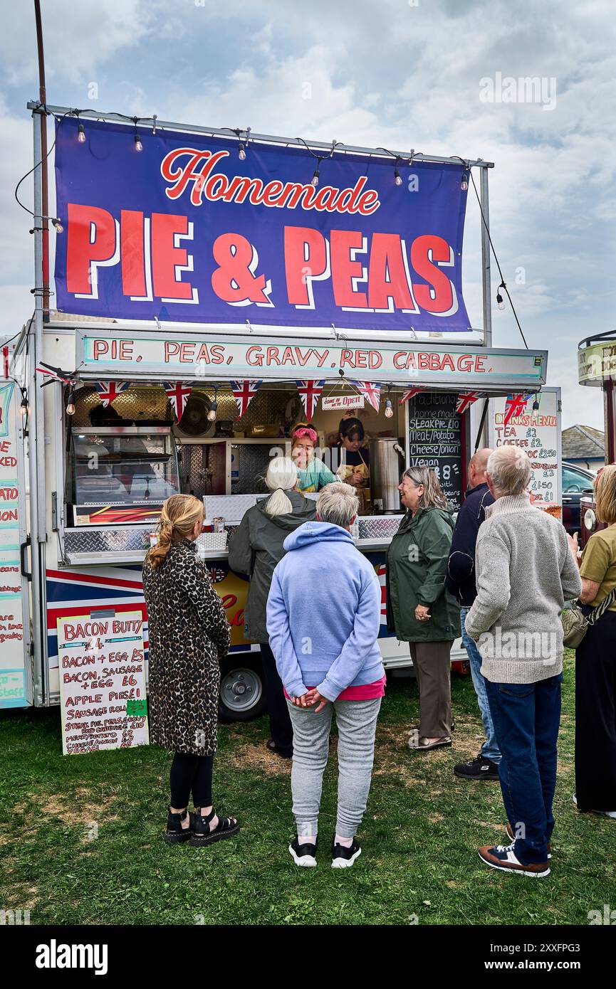 Pie and peas stall at fair Stock Photo - Alamy