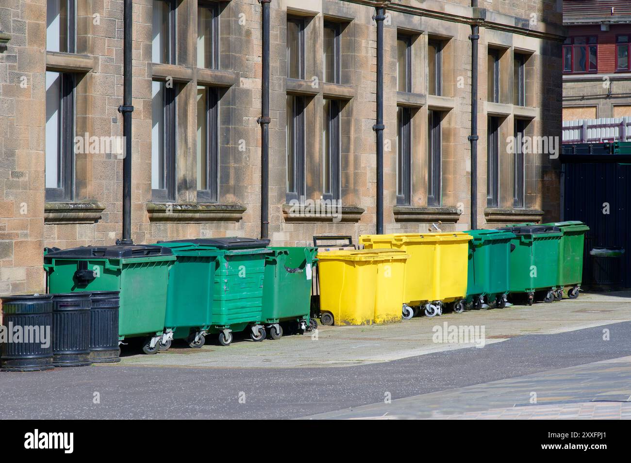 Wheelie bins in row for refuge collection outdoors Stock Photo - Alamy