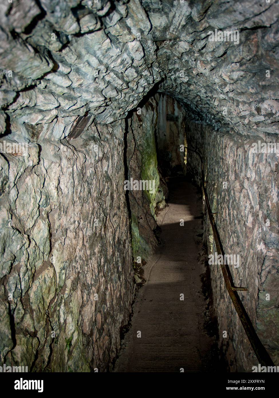 Vaulted passageway leading down to the dark cave and tunnel. Carreg ...