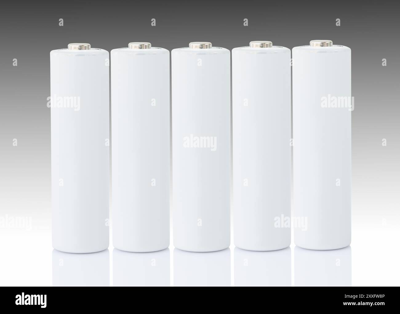 Close up white AA batteries over white background Stock Photo - Alamy