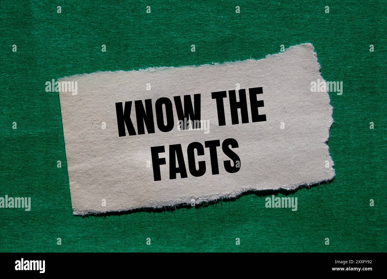Know the facts message written on ripped torn paper piece with green ...