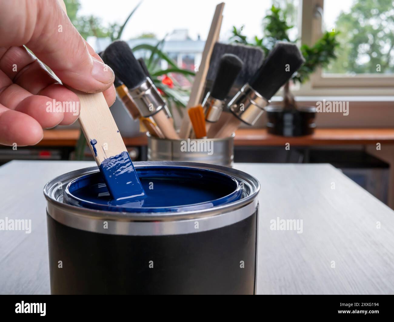 Wooden paintbrush in paint hi-res stock photography and images - Alamy