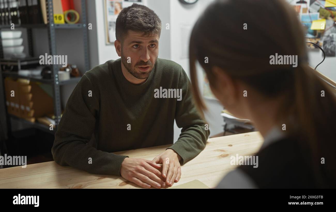 Inquisitive woman interrogates anxious man in a cluttered investigation ...