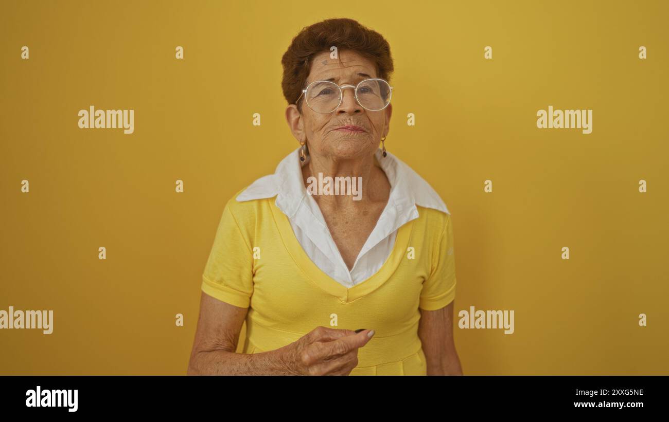 Elderly hispanic woman with short hair standing against an isolated ...