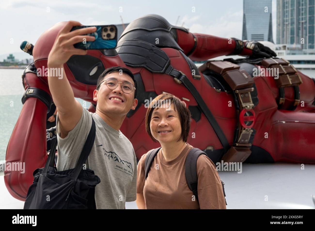 Hong Kong, China. 18th Aug, 2024. People take a selfie with the 8-meter ...