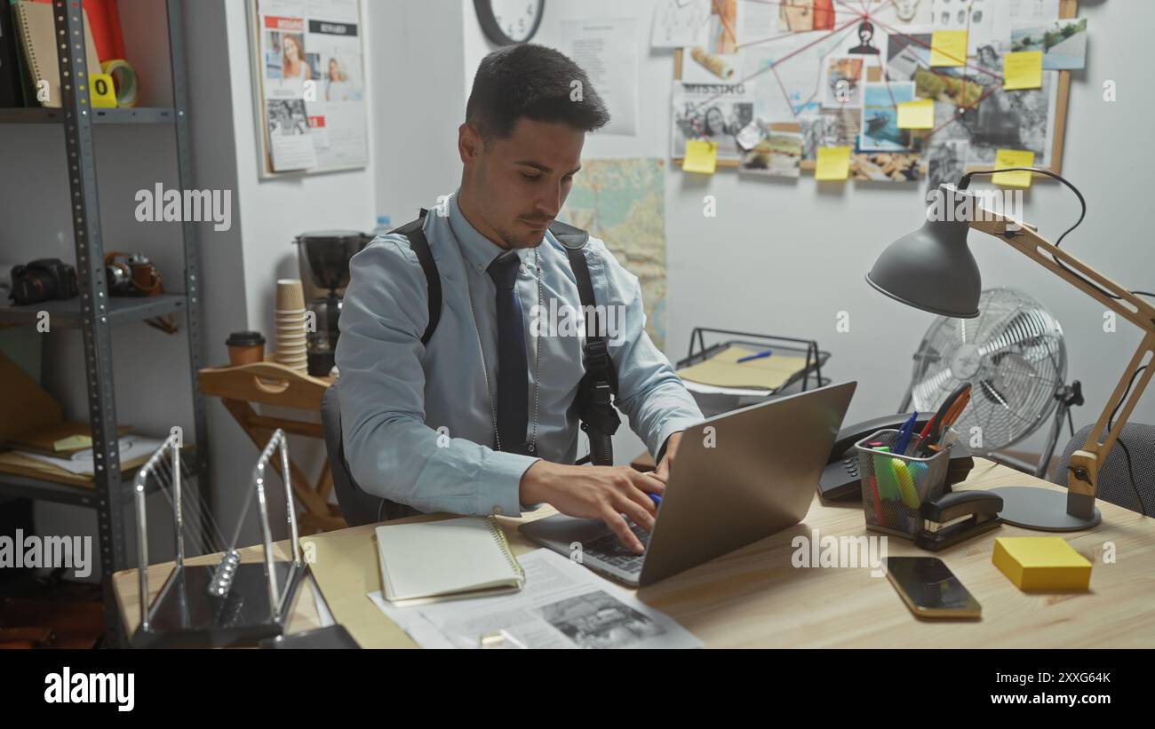 Focused man in detective office with laptop, evidence board, desk ...