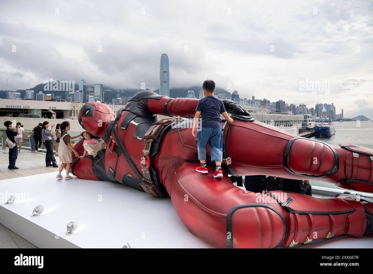 Hong Kong, China. 18th Aug, 2024. Locals and tourists pose for photos ...