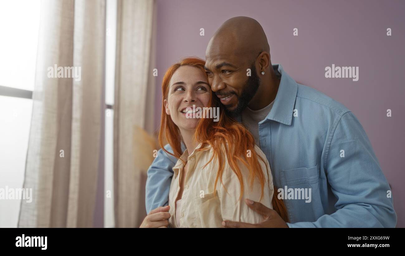 Couple sharing a loving moment at home with a warm embrace in the ...