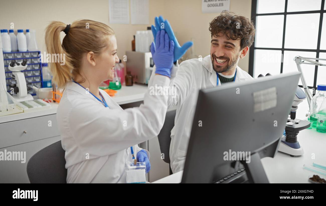 Science teamwork high five hi-res stock photography and images - Alamy