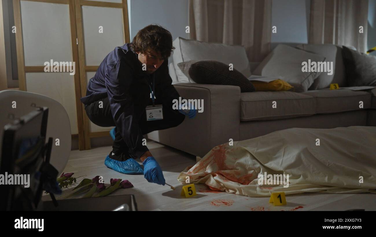 Man analyzes a bloody crime scene indoors with evidence markers ...