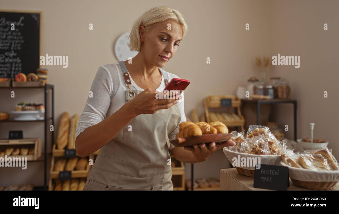 Blonde woman taking a photo of pastries inside a bakery shop with ...