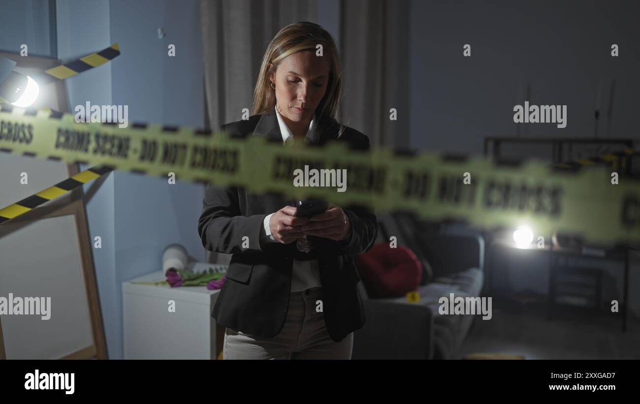 Focused young woman detective analyzes evidence using smartphone at ...
