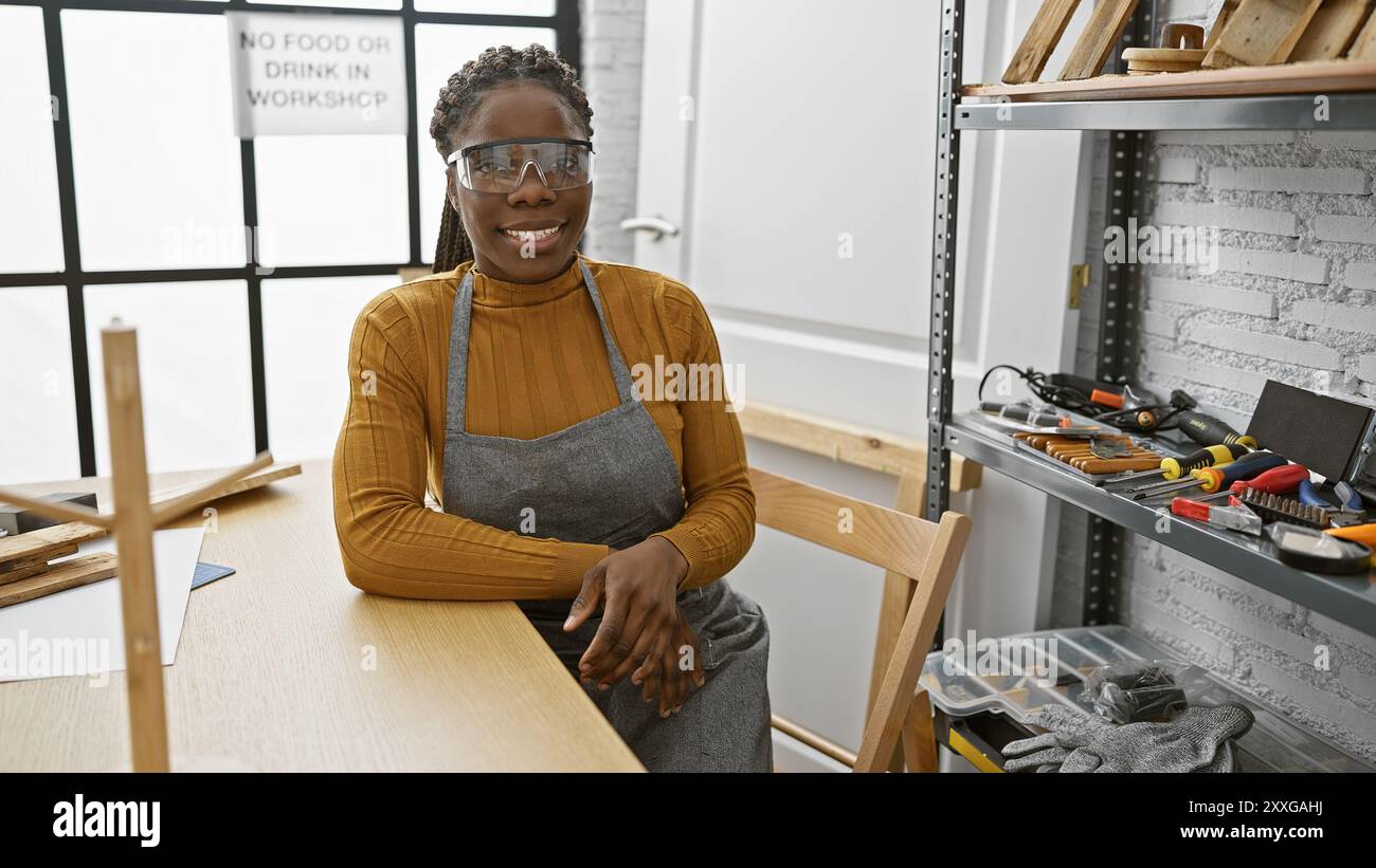 African american woman with braids wearing goggles smiles in a ...
