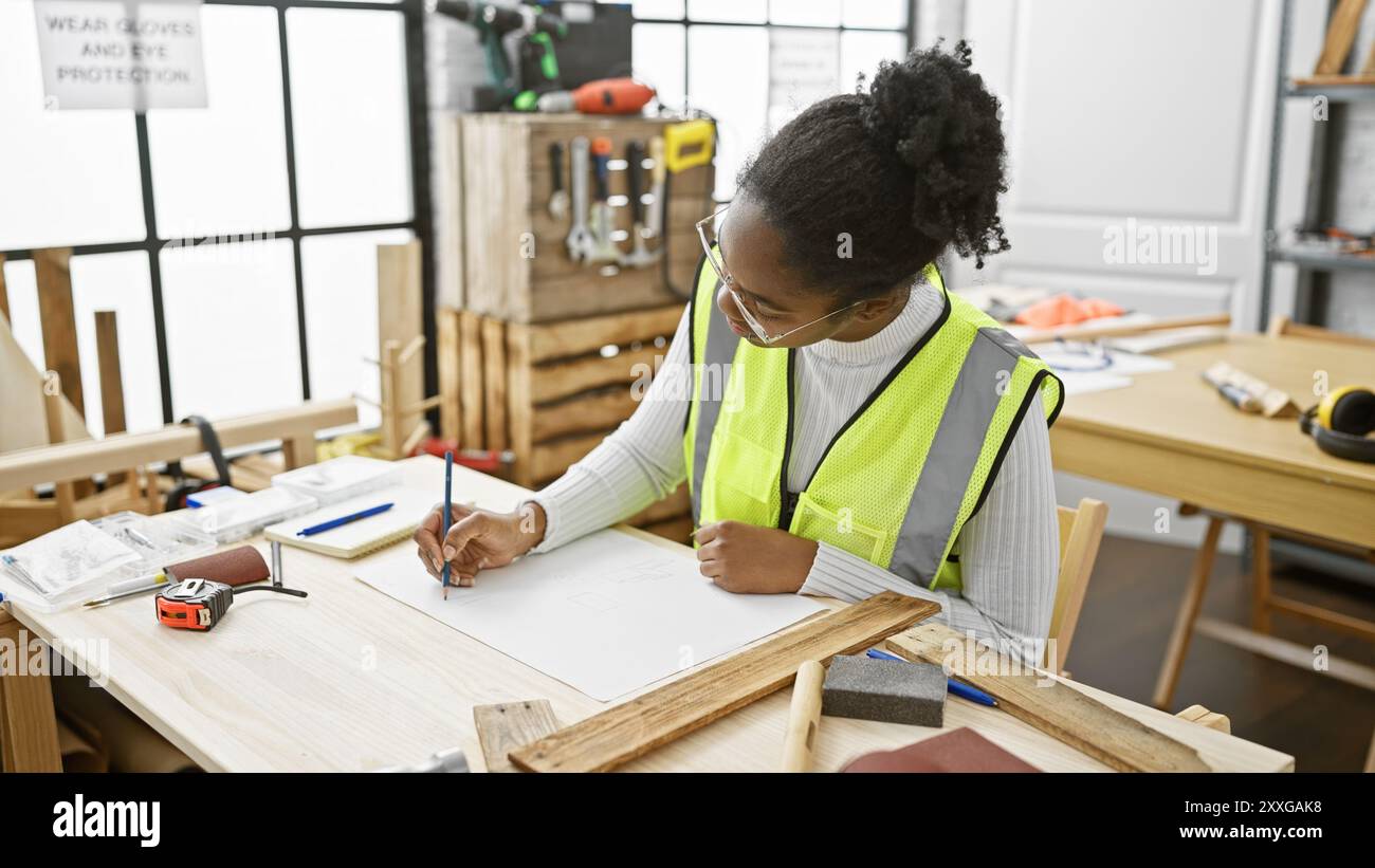 African american woman drafts plans hi-res stock photography and images ...