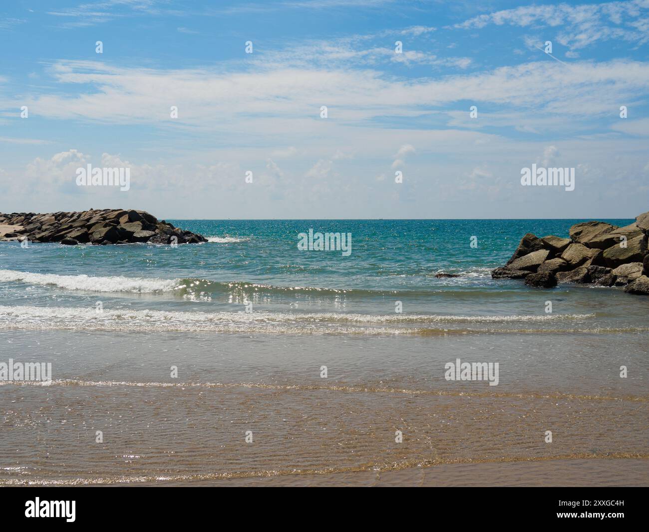 Small half moon bay and bended waves created by stone manmade ...