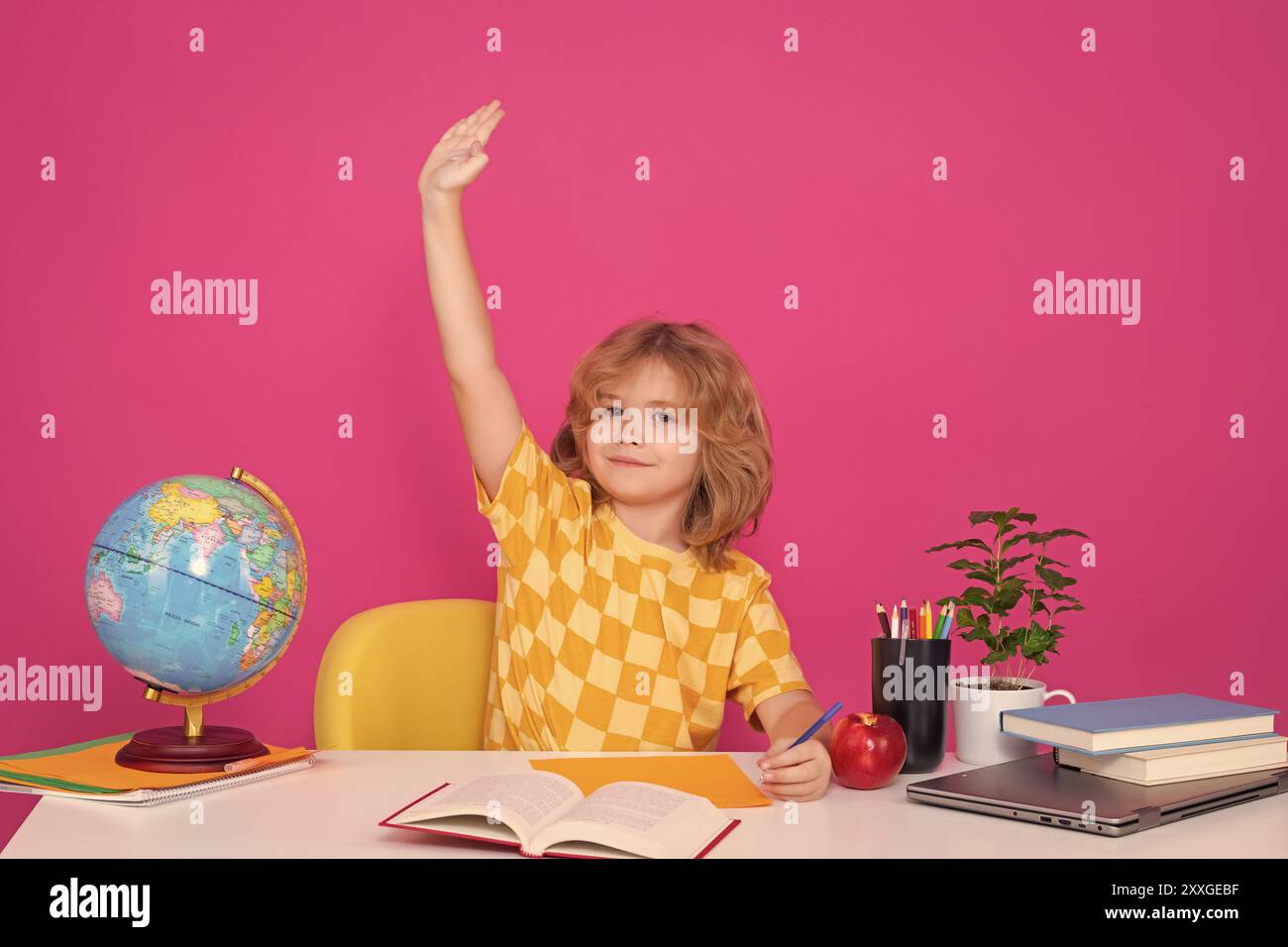 School child raising hands, willing to answer question. Smart caucasian ...