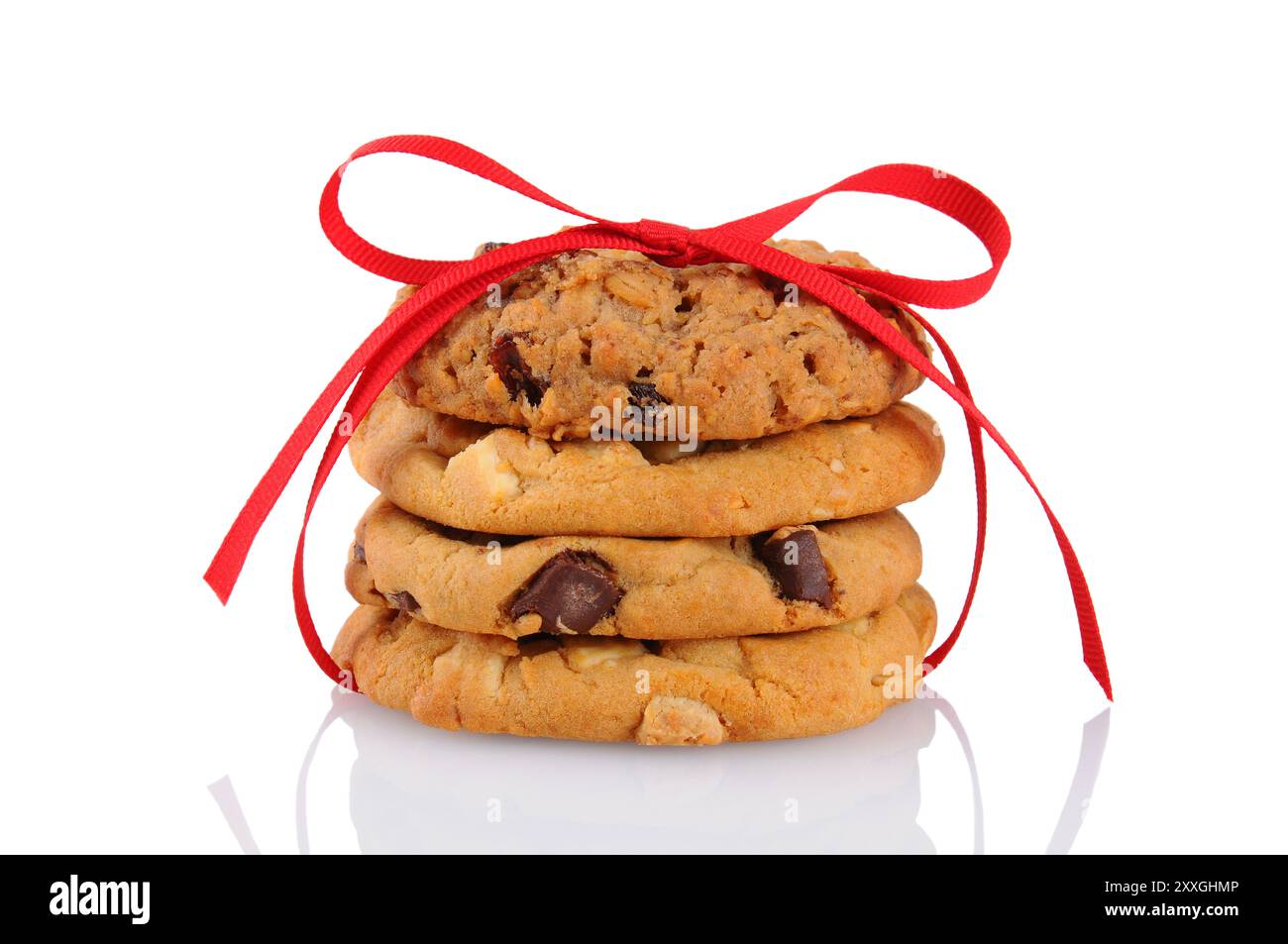 Closeup of a stack of assorted cookies tied up with a red ribbon ...