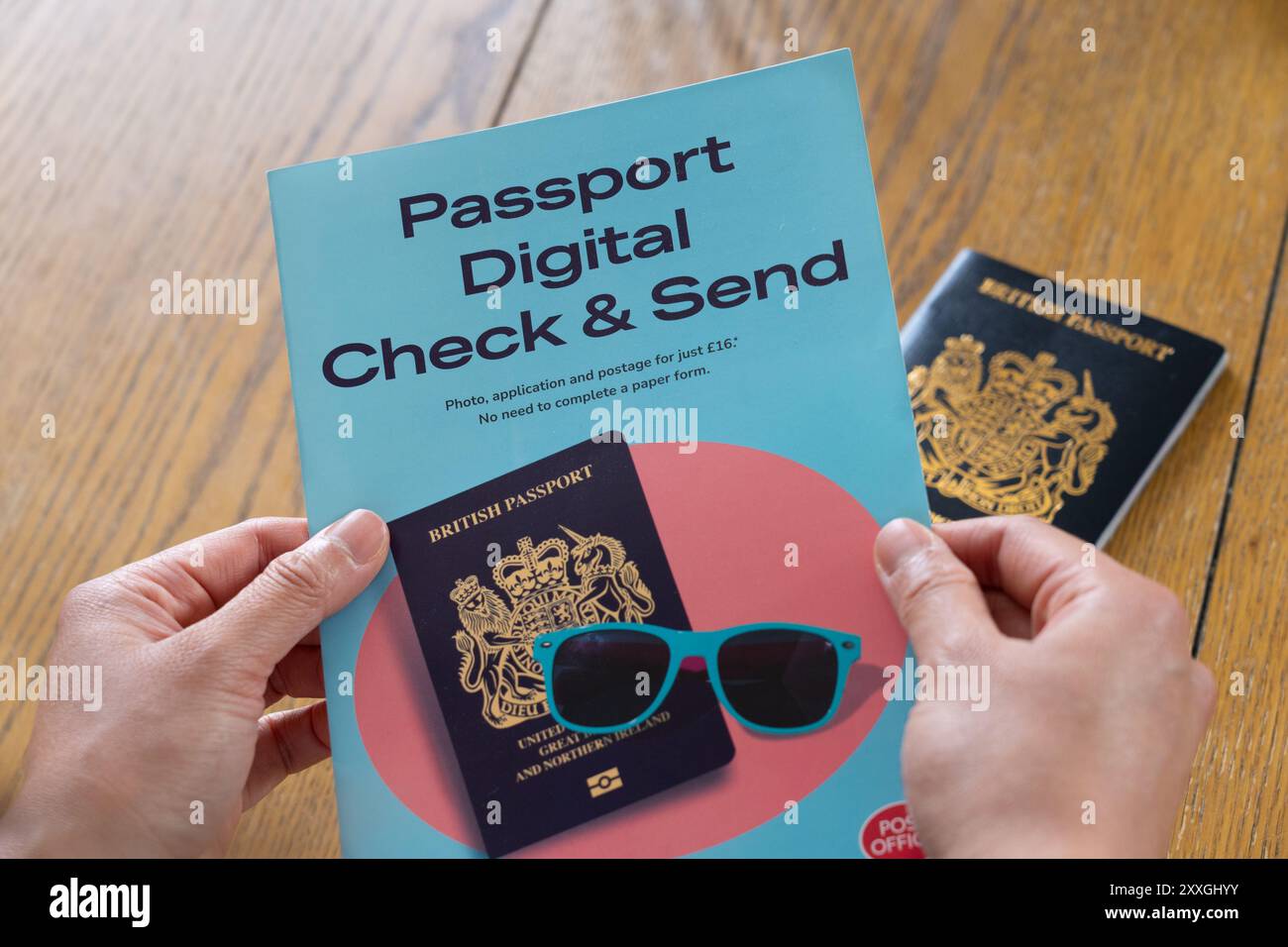 Man holding a flier from the Post Office advertising a passport digital ...