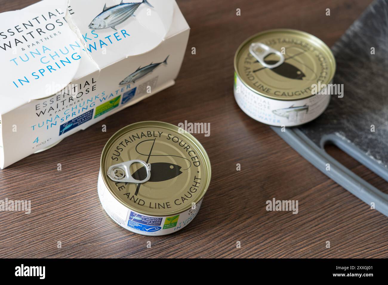 Tins of Waitrose supermarket tinned tuna fish with the caption that the ...